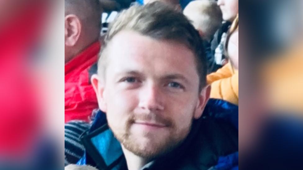 Rugby fan died in garage fire 'caused by cigarette' - BBC News