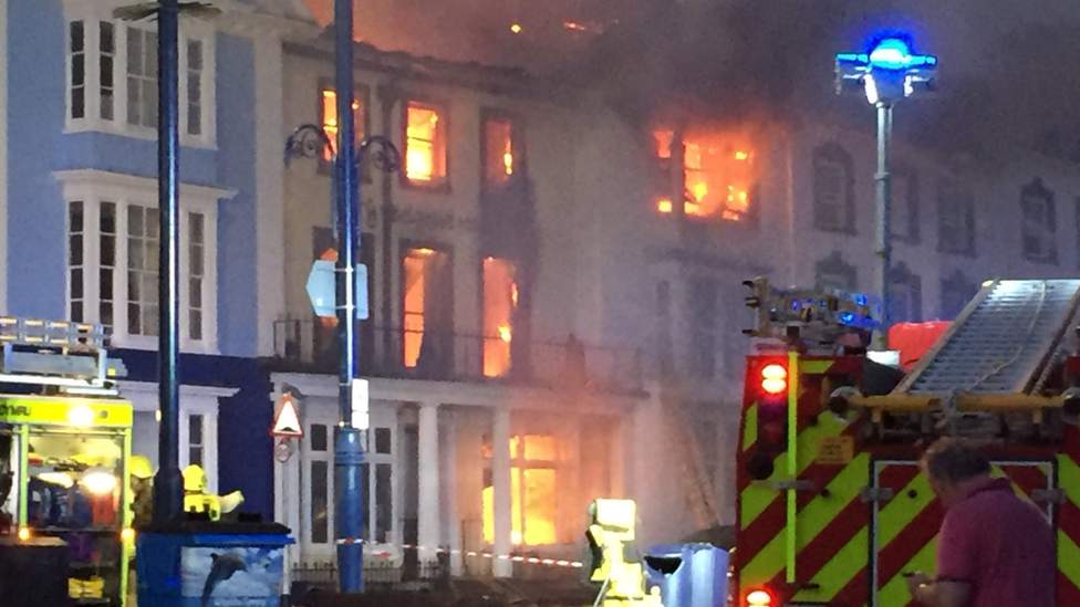 Aberystwyth fire: Missing man police search burnt hotel - BBC News