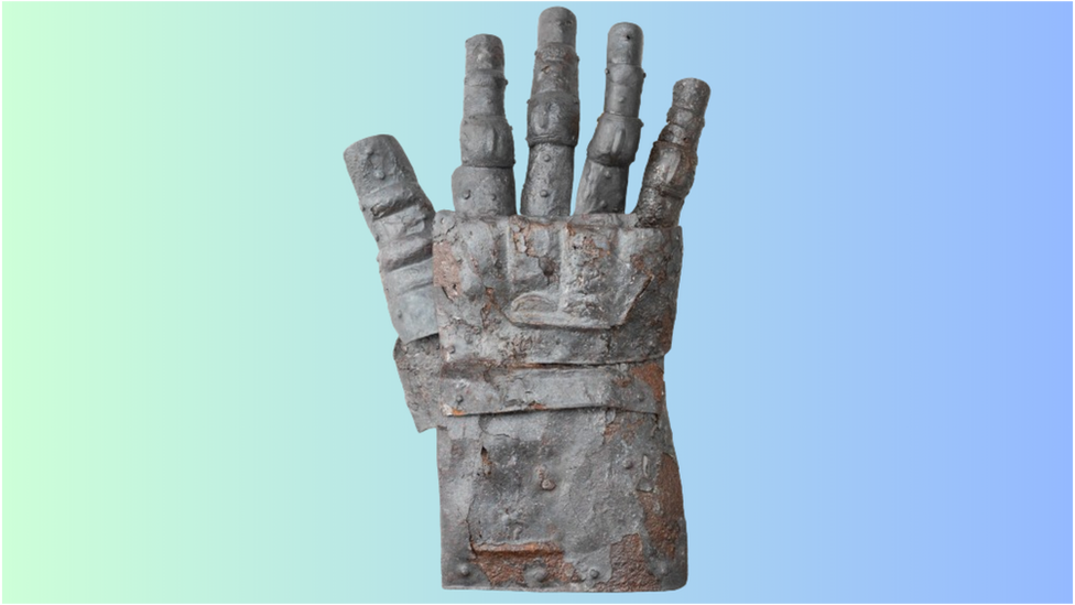 A 600-year-old iron gauntlet discovered in a Swiss cellar - BBC Newsround