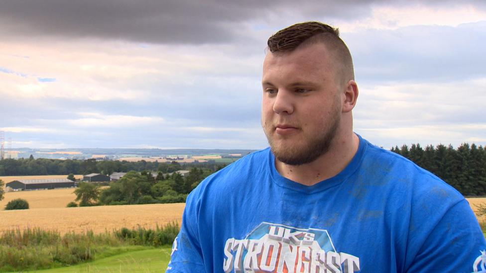 Tom Stoltman: Scot lifts World's Strongest Man title - BBC News