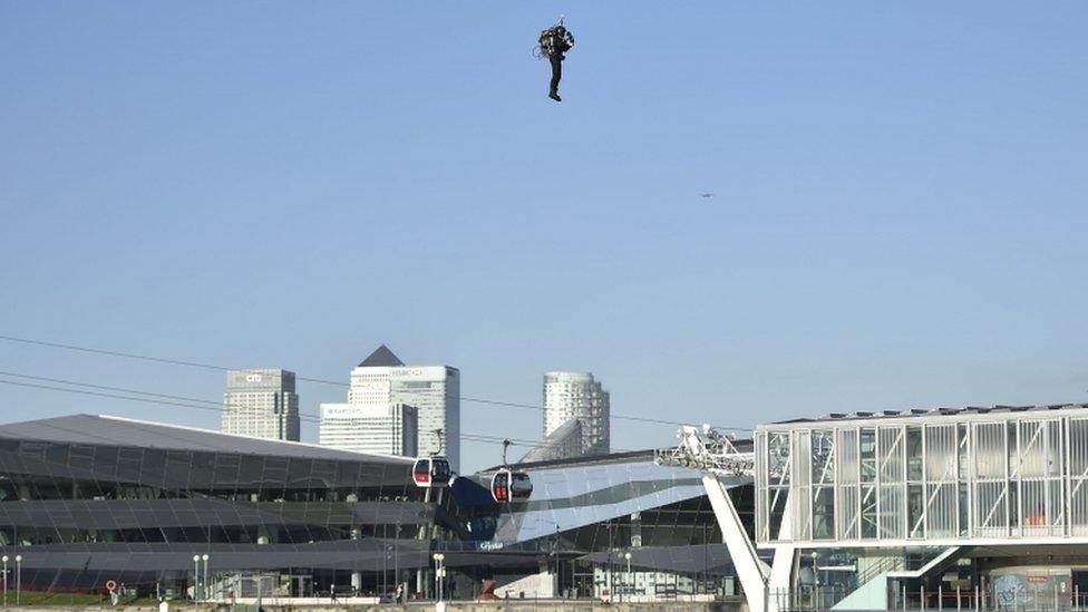 Jetpack pilot takes flight above London - BBC News