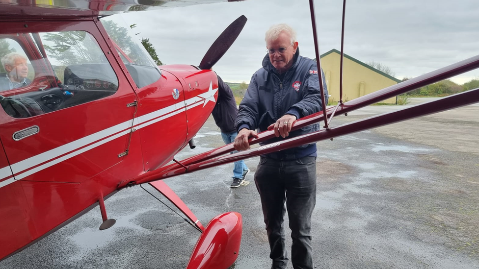 Bodmin pilot saves £1million of planes from hangar fire - BBC News