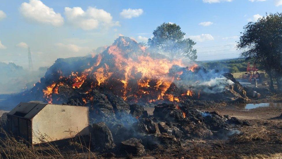 Fire crews tackle countryside haystack blaze in Swillington - BBC News