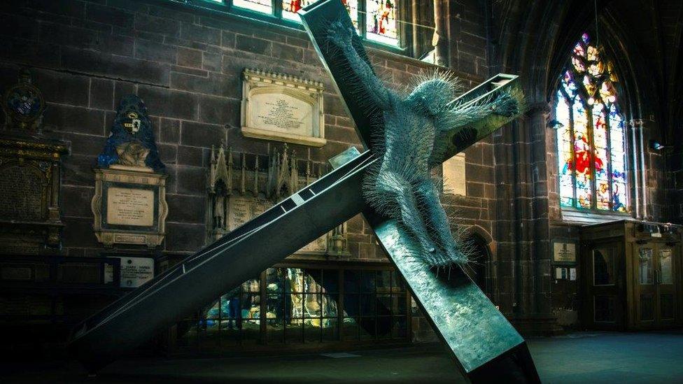 Chester Cathedral unveils coat hanger crucifixion sculptures - BBC News