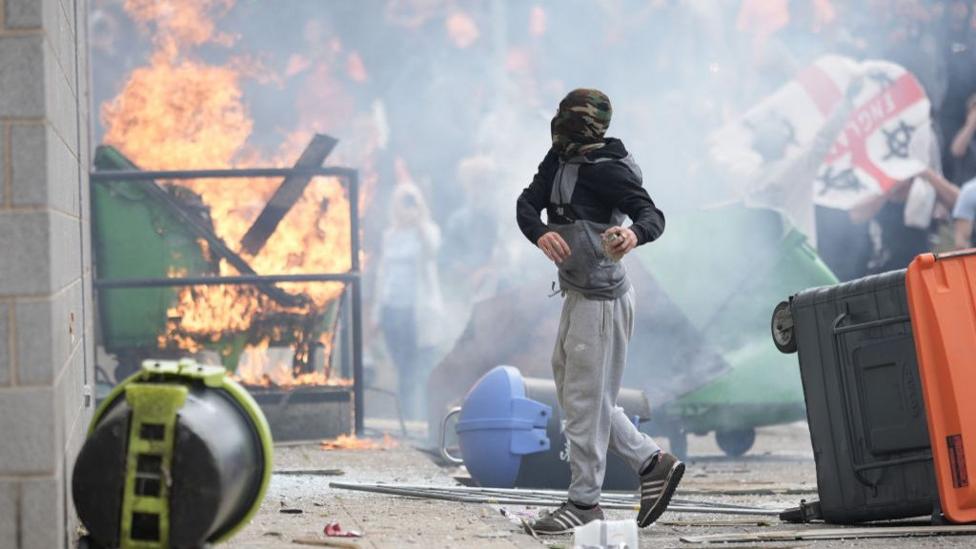 Woman pleads guilty to Southport riot offences - BBC News