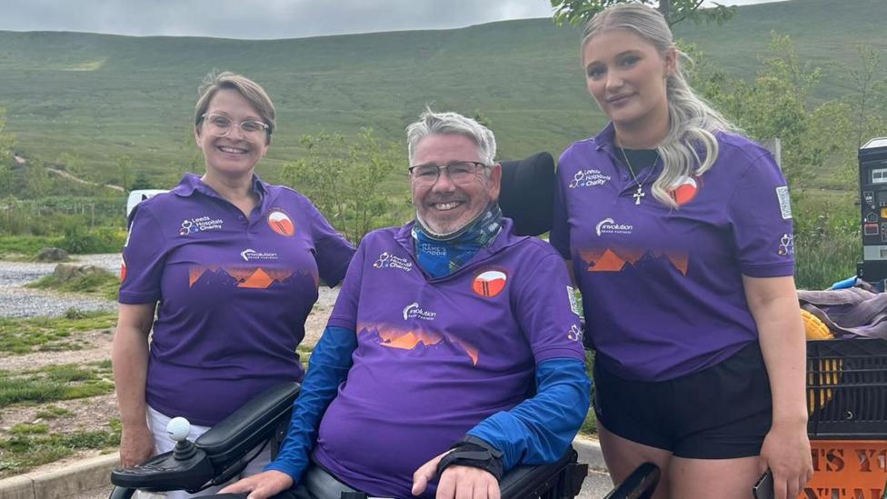 Rob Burrow: Man with MND scales Pen y Fan in wheelchair - BBC News