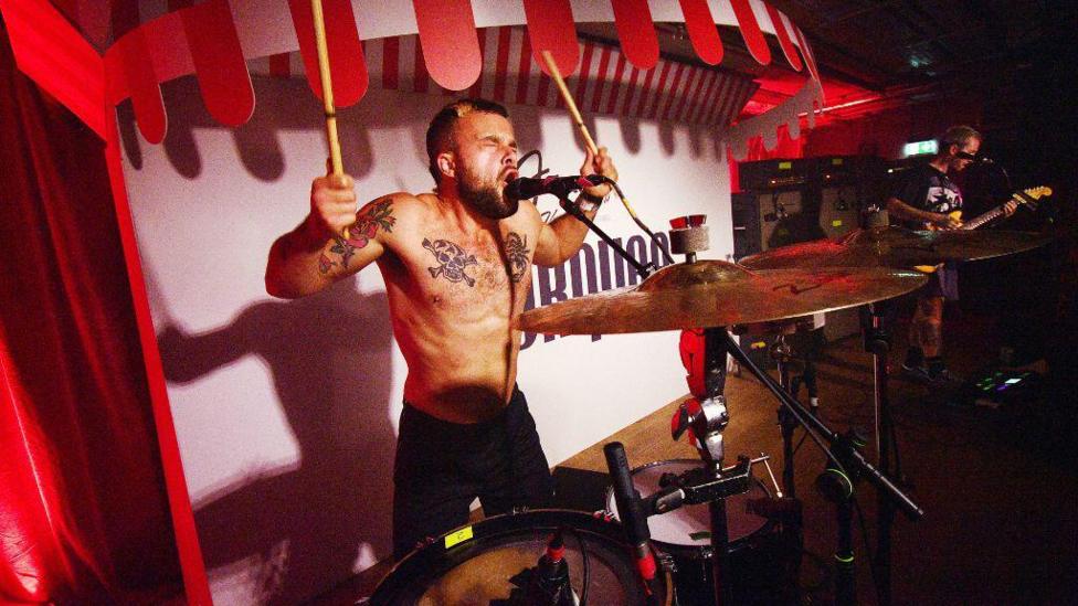 Soft Play: Finish line gig for man running length of Africa - BBC News