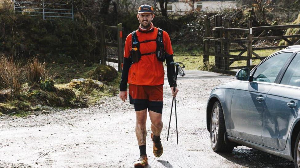 Dorset paramedic in 'world first' highest lakes swim challenge - BBC News