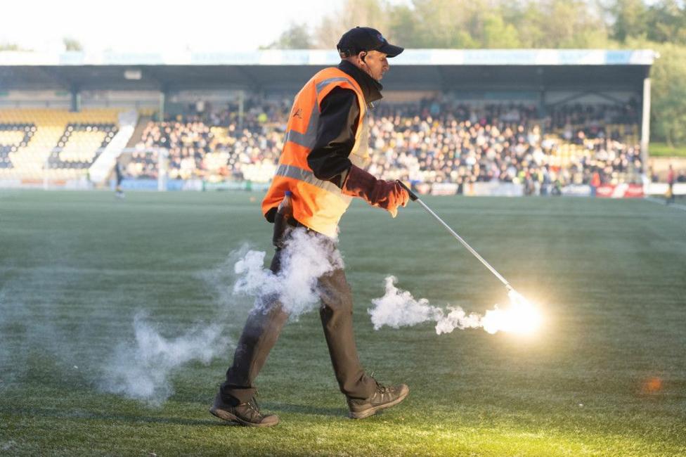 Football clubs demand tougher bans for pyro fans - BBC News