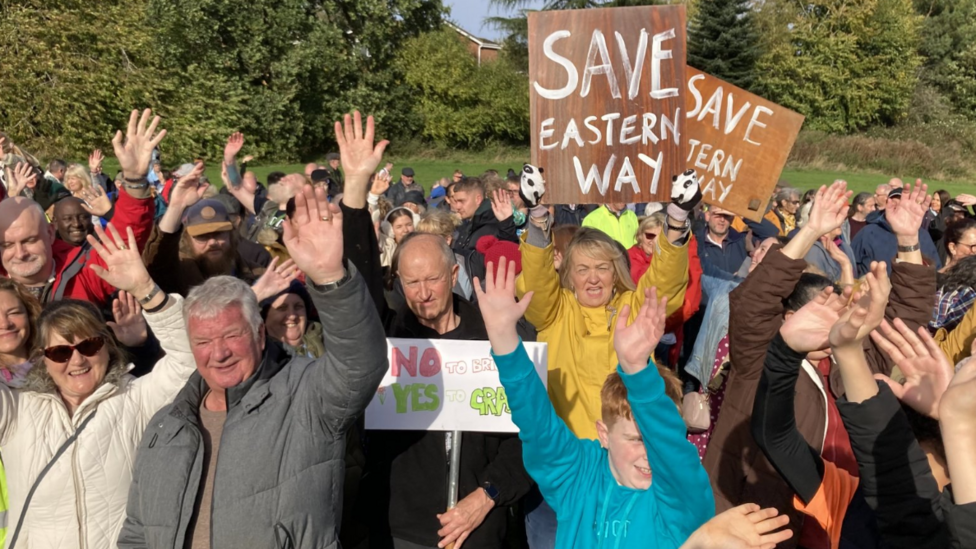 Daventry protesters gather over playing field sell-off plan - BBC News
