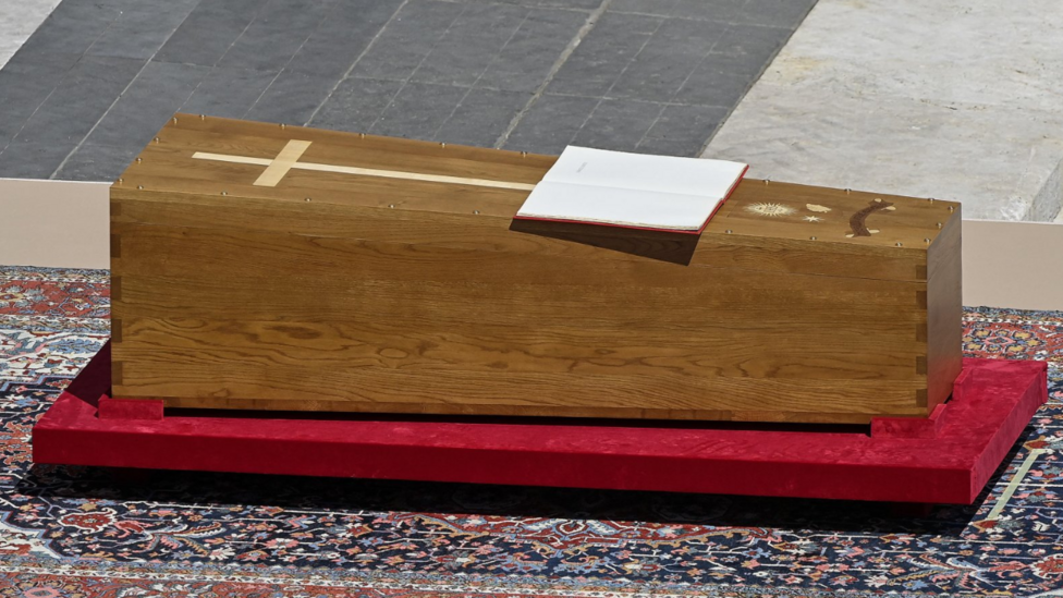 A simple wooden coffin amidst extraordinary opulence - BBC News