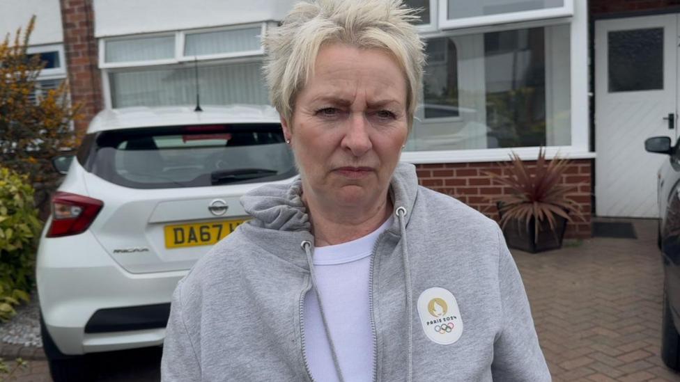 Woolton murder arrest after car 'deliberately driven at man' - BBC News