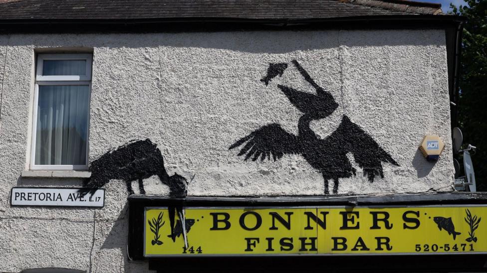 Banksy paints fish on police sentry box in London's Ludgate Hill - BBC News