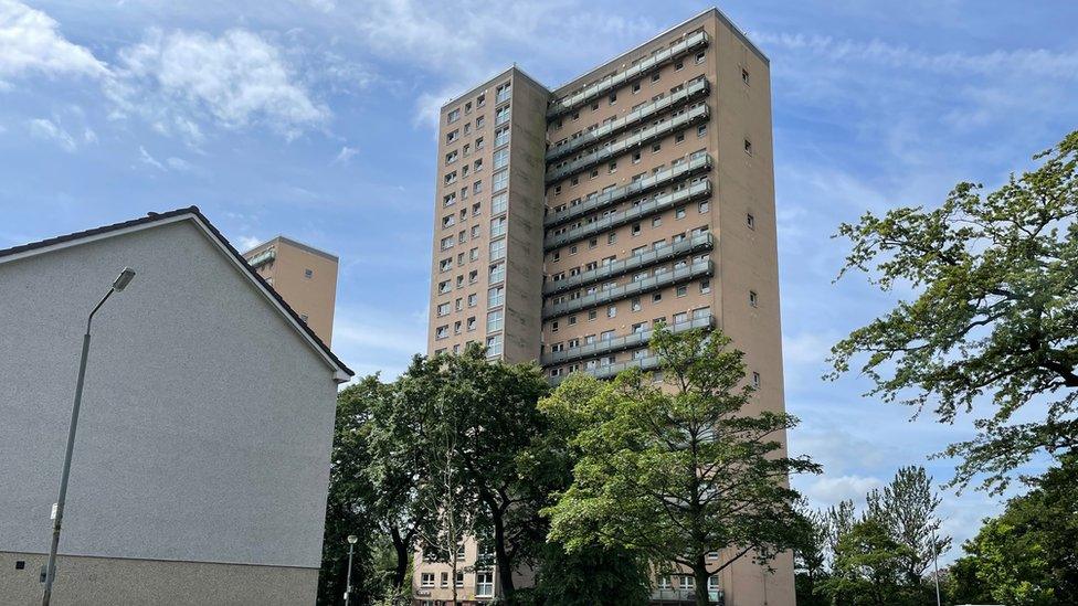 Man, 33, arrested in tower block murder probe - BBC News