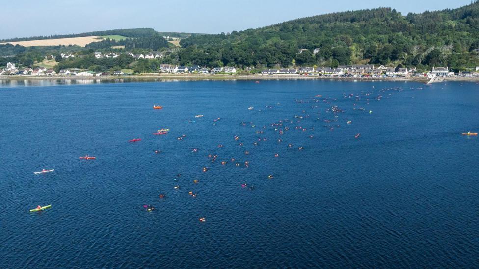 In pictures: Hundreds make a splash on Kessock Ferry Swim - BBC News