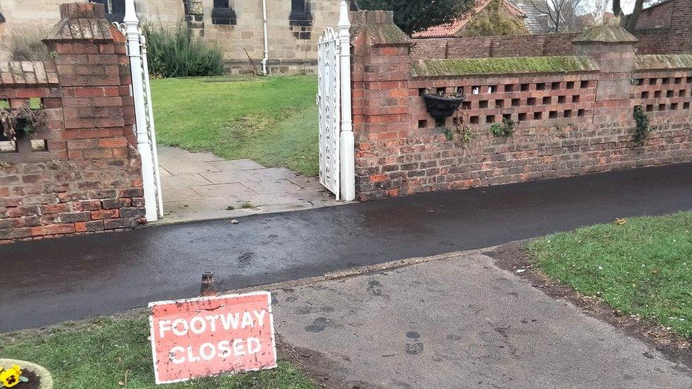 Footprints left in wet tar after workers fail to rope off pavement ...
