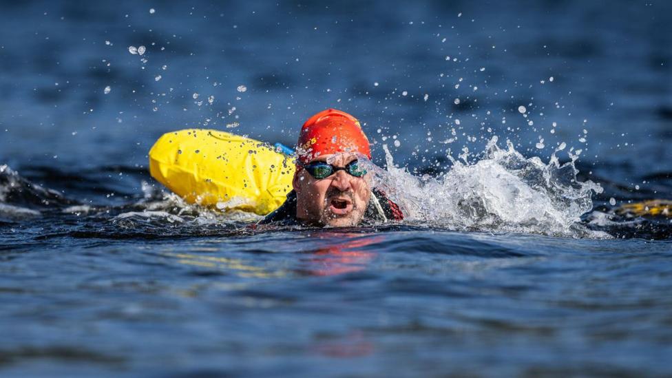 In pictures: Hundreds make a splash on Kessock Ferry Swim - BBC News