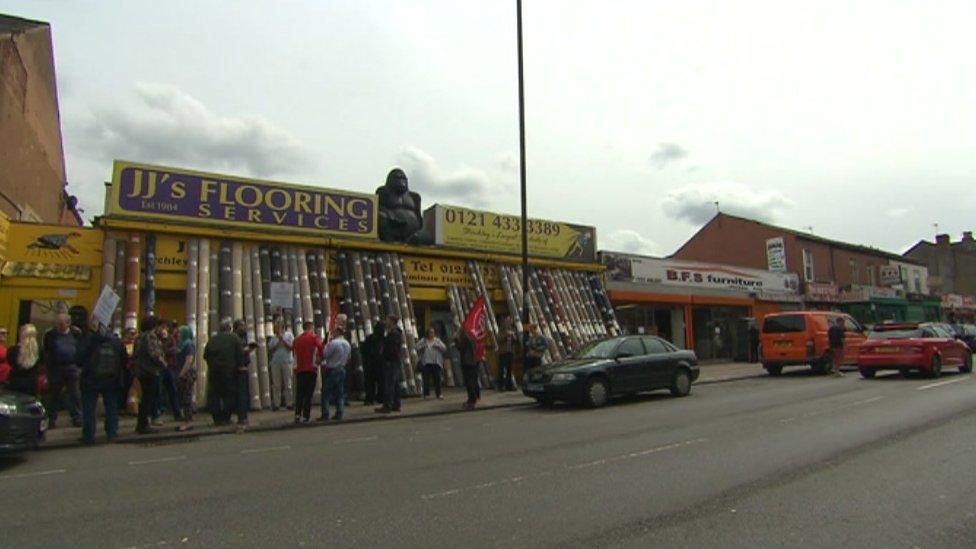 Tenants protest outside Birmingham freeholder's shop - BBC News