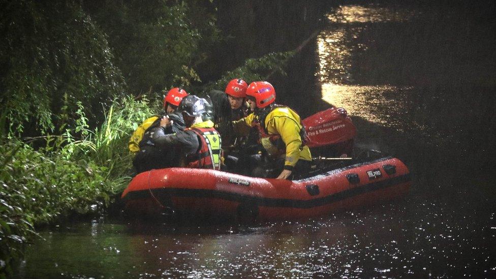 Handcuffed man rescued after jumping into Manchester canal - BBC News