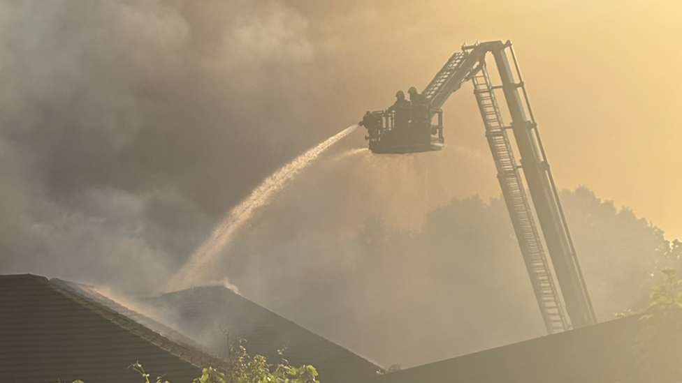 Firefighters on scene of 'destroyed' former golf club building - BBC News
