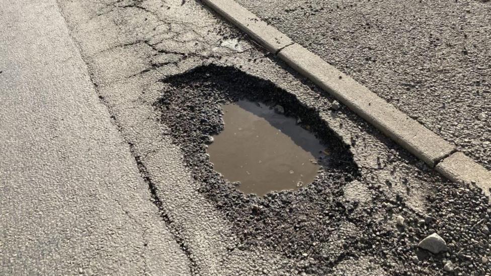 Surrey County Council launches new pothole reporting tool - BBC News