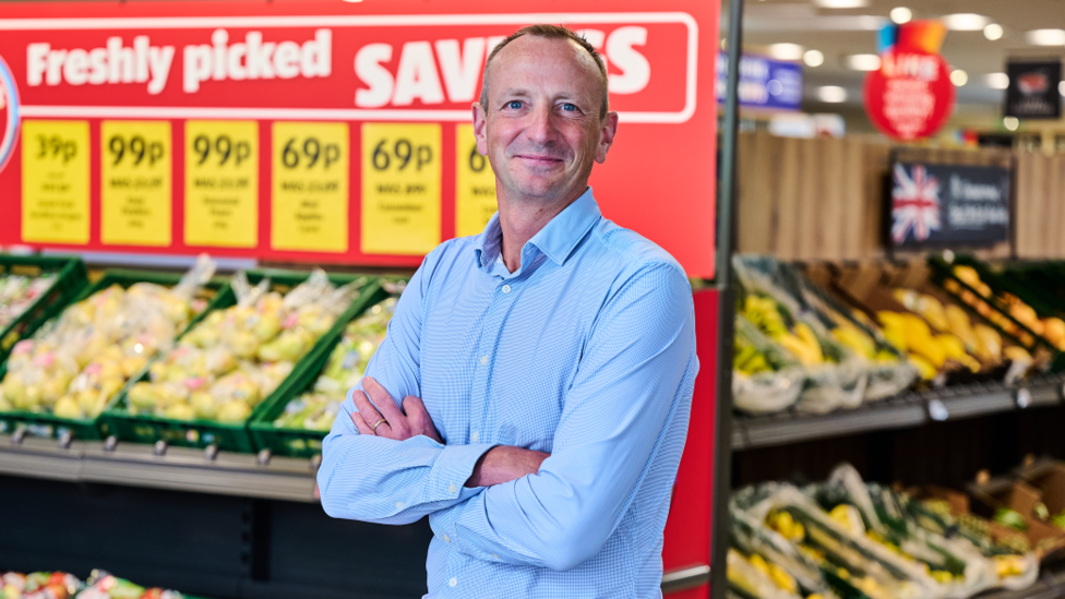 Aldi shoppers treat themselves as cost pressures ease - BBC News
