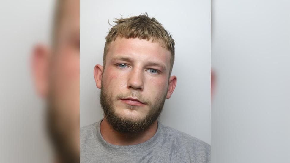 Swindon driver who dragged police officer along ground jailed - BBC News