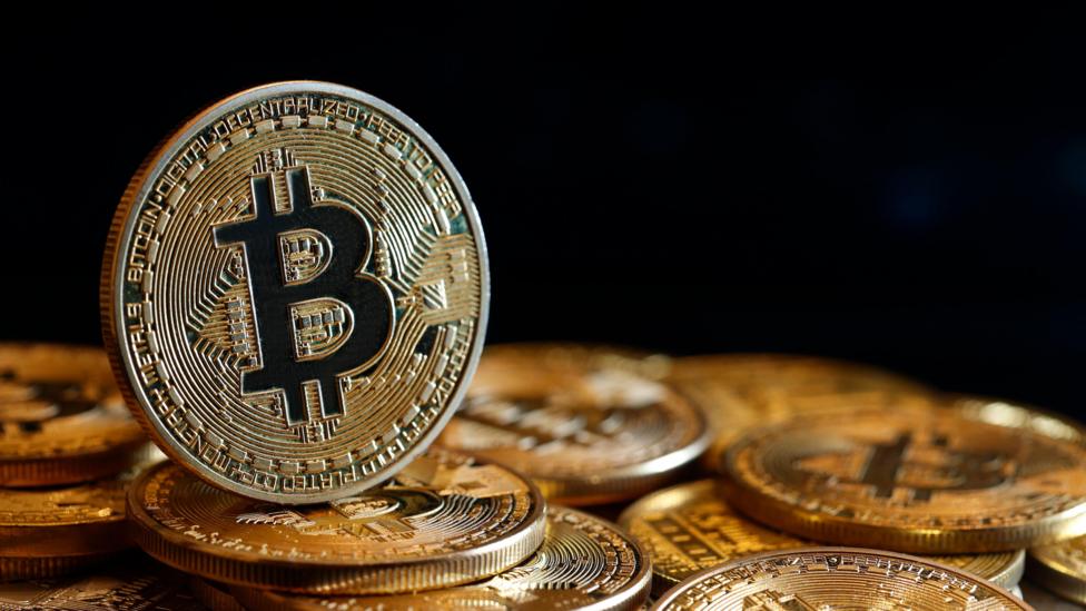 Officer who stole Bitcoin from crime network on dark web jailed - BBC News