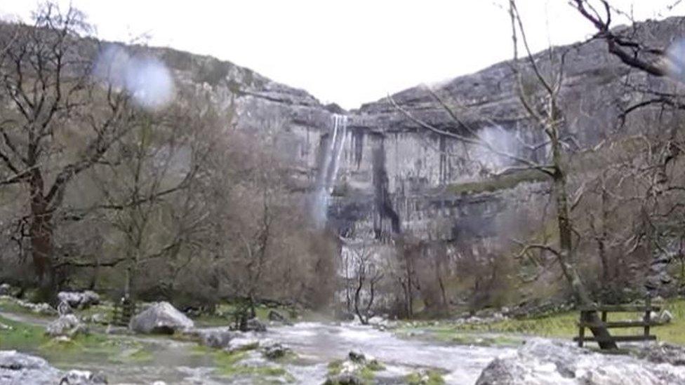 Storm Desmond: Malham Cove waterfall flows again amid heavy rain - BBC News