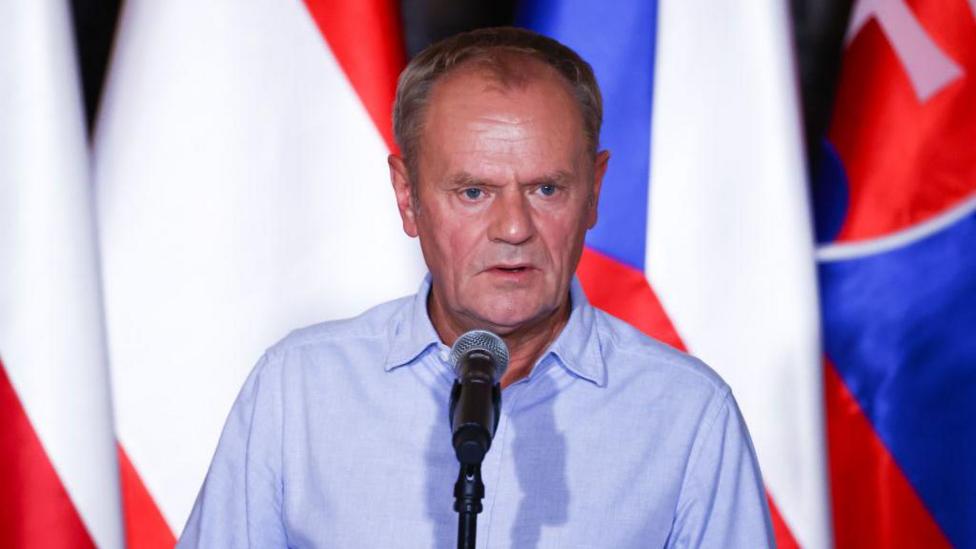 Poland to temporarily suspend right to asylum, PM Tusk says - BBC News