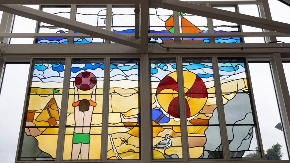 Monkseaton station's glass repaired by artist's ex-pupil - BBC News