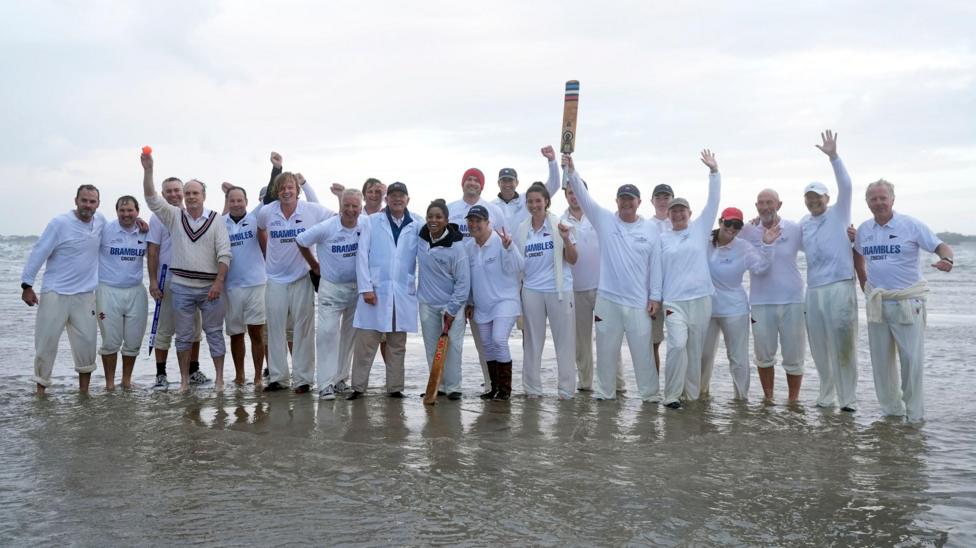 In pictures: cricketers play Bramble Bank Match in the sea - BBC News