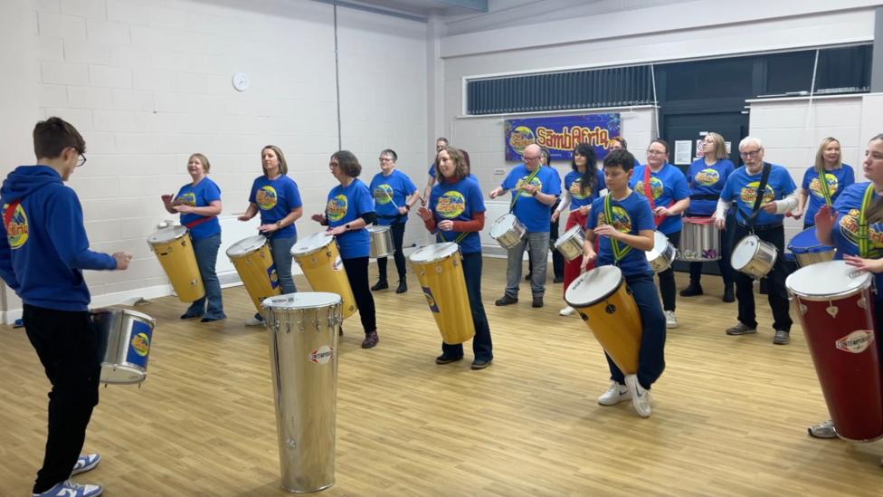 Rising star samba band director, 18, spreads 'upbeat' joy in hometown ...
