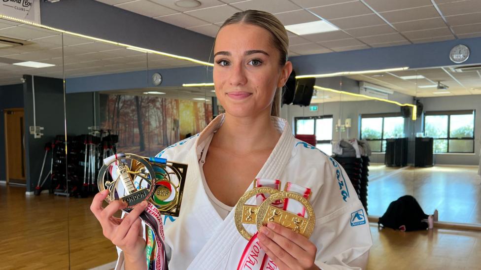 Hampshire karate champion to head to tournament for late brother - BBC News