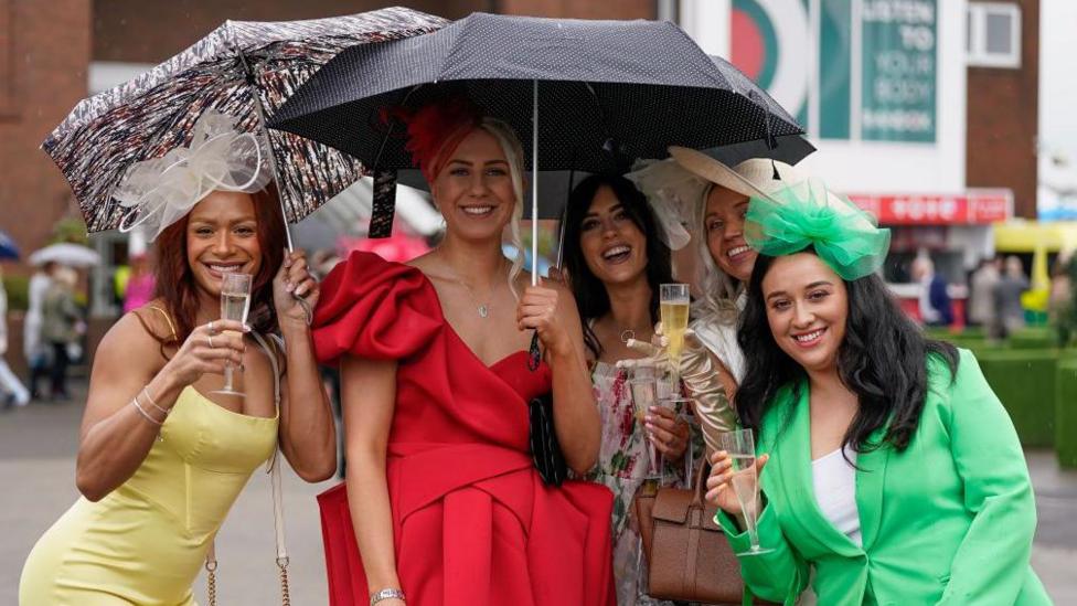 Aintree Festival Ladies Day fashions over the years - BBC News