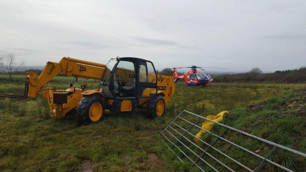 Man run over by JCB forklift in field - BBC News