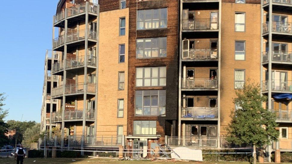 Clapton flats fire: Woman rescued during 'suspicious' blaze - BBC News