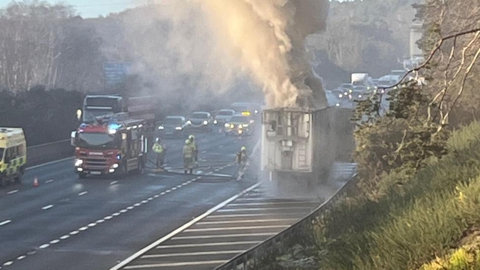 M3 closed northbound after electrical waste fire in lorry trailer - BBC ...