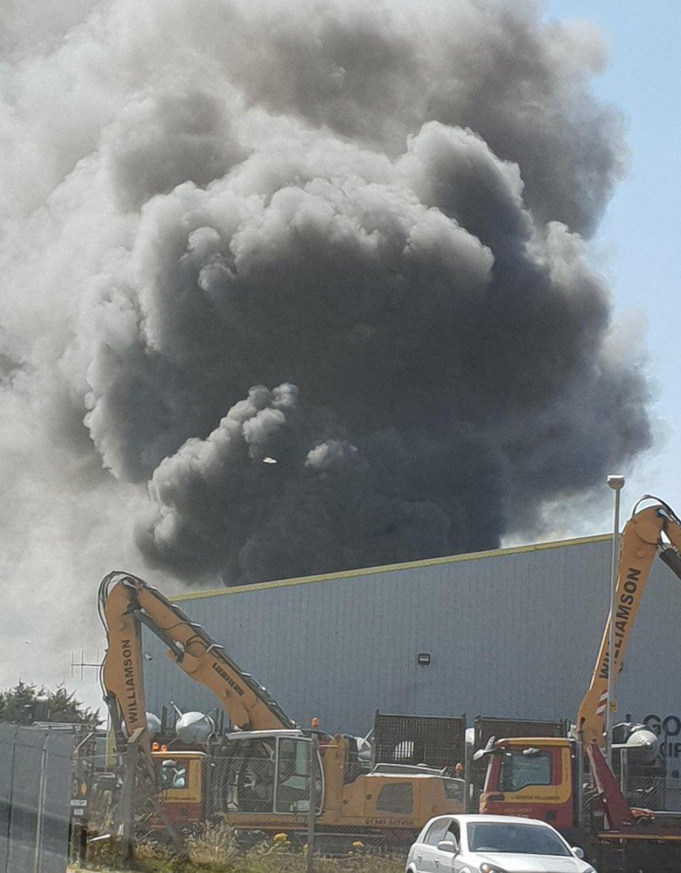 Fire crews tackle industrial estate blaze in Elgin - BBC News