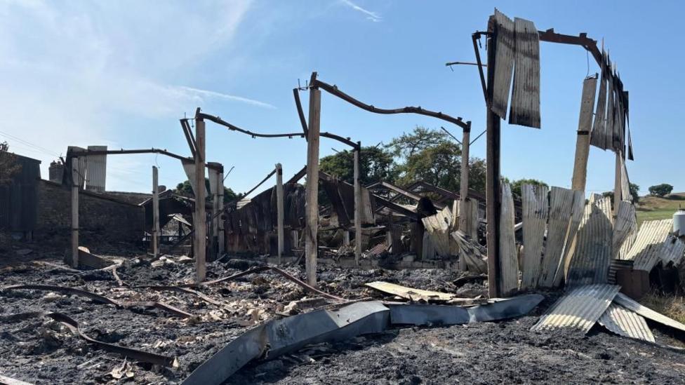 Shropshire barn fire 'ripped the heart out' of family farm - BBC News