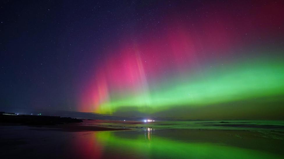 Rare red-toned Aurora Borealis lights up skies across Scotland - BBC News