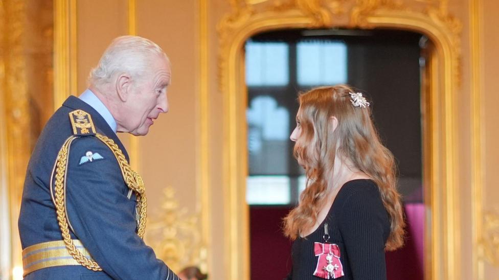 Poppy Maskill: Paralympics swimming star collects MBE - BBC News