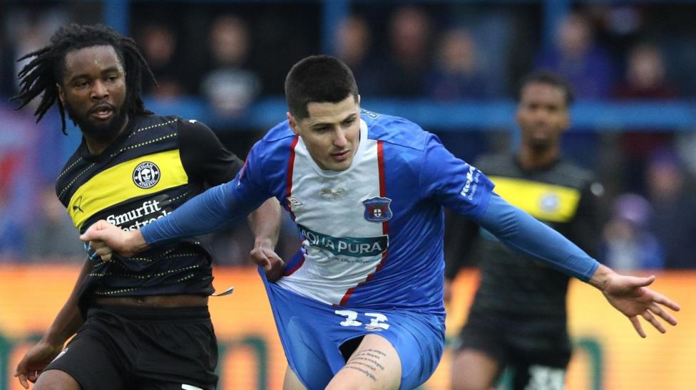 Jon Mellish: Wigan Athletic sign defender from Carlisle United - BBC Sport