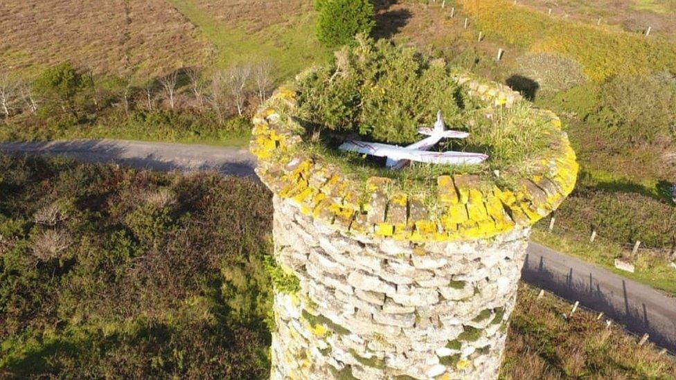 Crashed model aeroplane rescued by the navy - BBC News