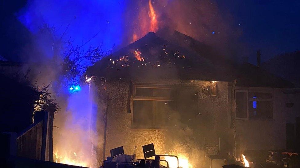 Dad woken early by son saves seven from Prestatyn house fire - BBC News