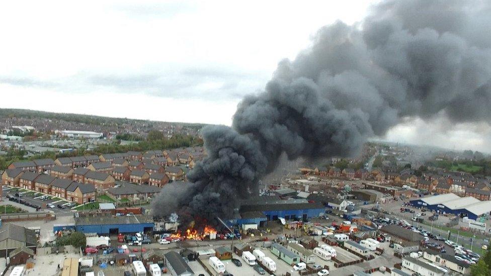 Widnes fire: Firefighters tackle blaze on industrial estate - BBC News