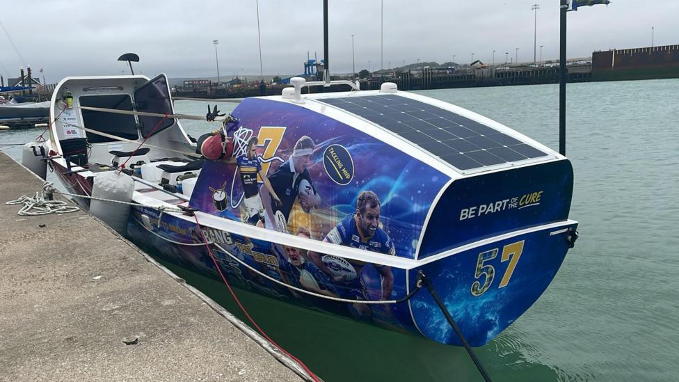 Charity rowers shelter from Storm Floris in Newhaven Marina - BBC News