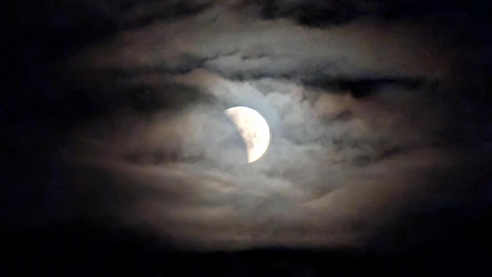 In pictures: Lunar eclipse captured over Northern Ireland - BBC News