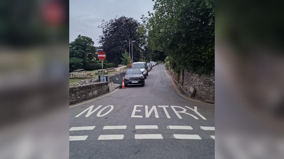 Cornwall road marking fixed after letter painted backwards - BBC News