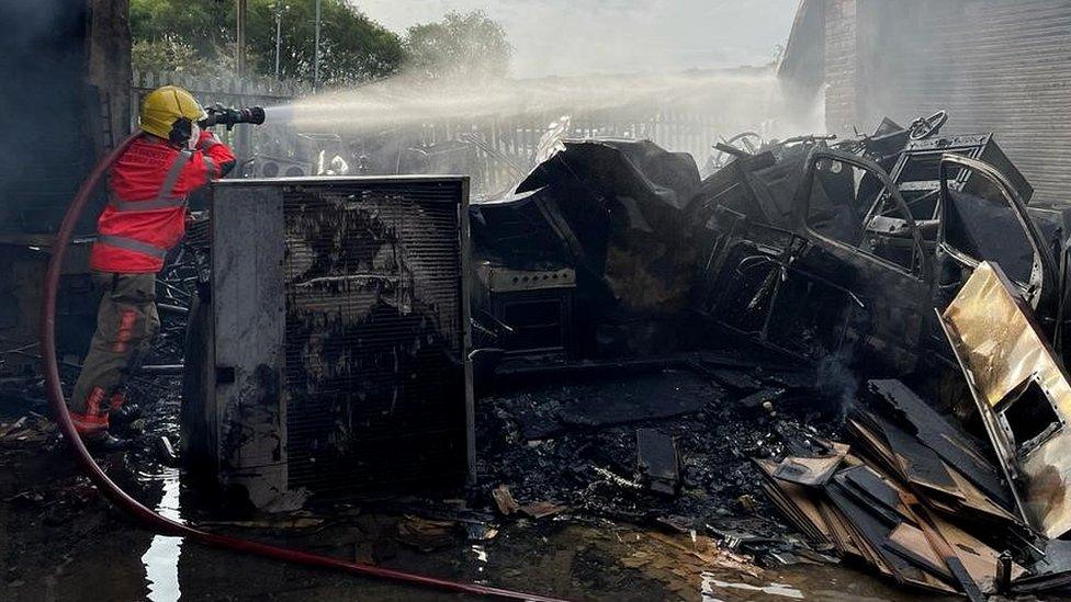 Manchester fire crews tackle huge blaze at industrial site - BBC News